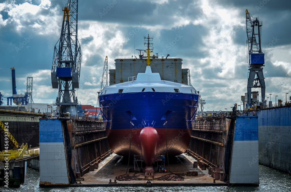 Container ship in dry dock Stock Photo | Adobe Stock