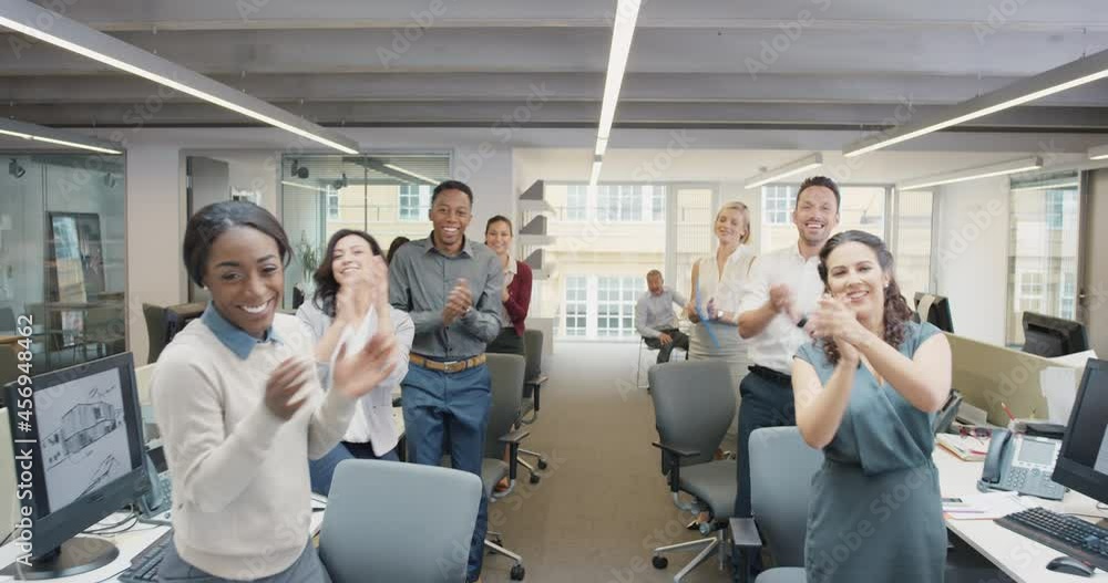 Congratulations businessman receiving praise as team members clap in ...