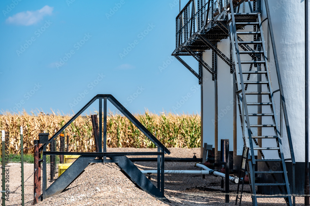 Ramp and stairs over a secondary containment dike for chemical oil ...