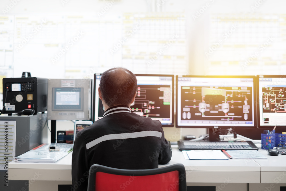 Foto de Professional technician sitting in control room monitoring ...