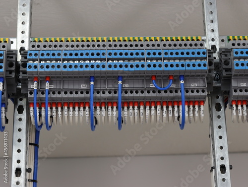 Pass-through electrical terminals for connecting wires in electrical ...