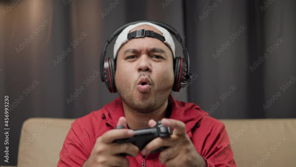 Angry asian gamer man. He lose in the game. Missed the chance to become ...