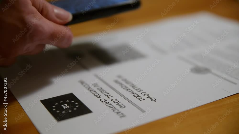 Person scanning the QR code of a covid 19 certificate. Scanning the ...