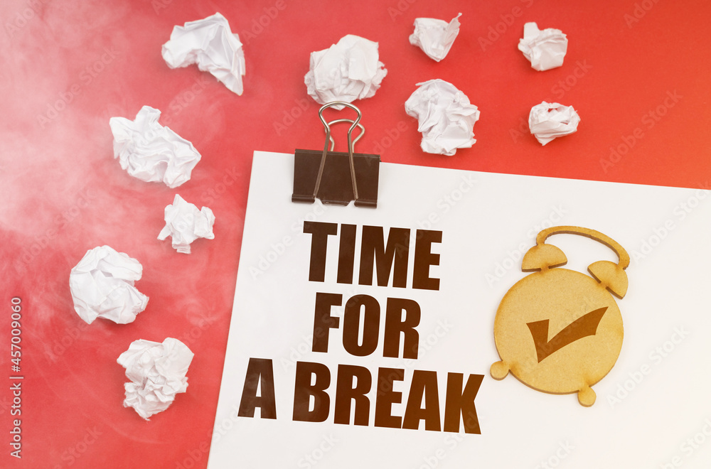 On a red background in smoke, crumpled paper and a sheet with the ...