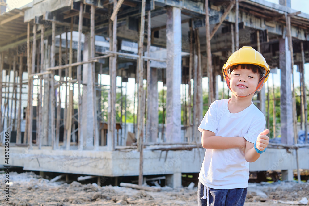 Cute Asian smiling happy kindergarten boy kid wearing yellow ...