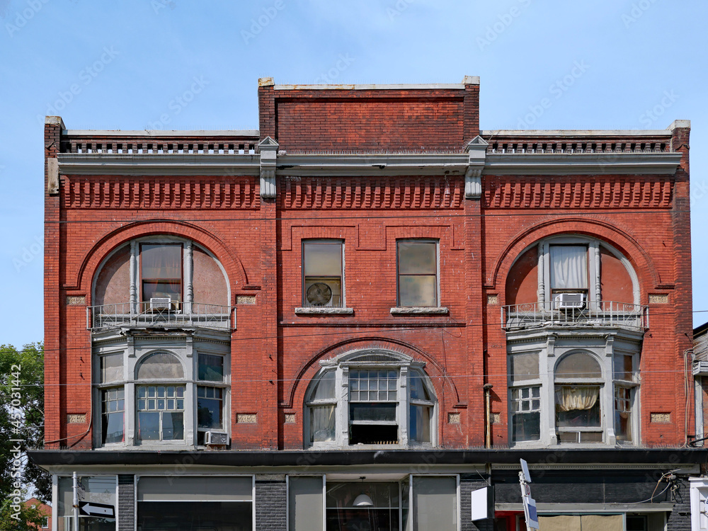 Facade of the type of ornate brick main street commercial building ...