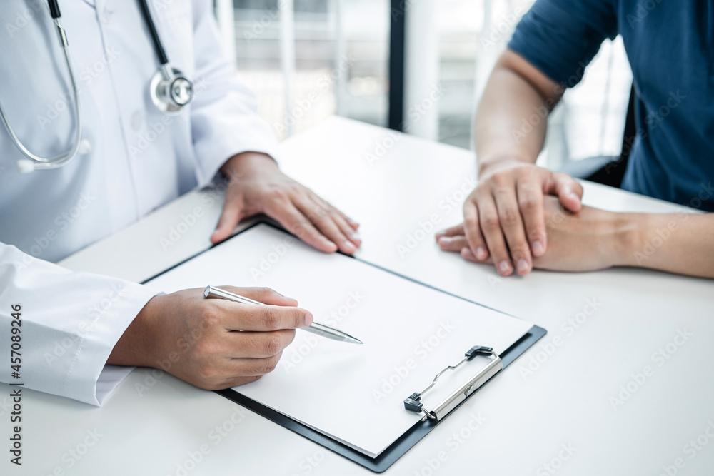 Doctor is explaining the symptoms to the patient at medical clinic ...