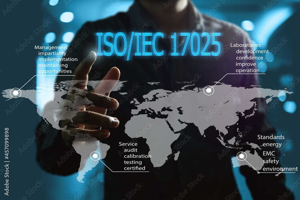 Man pointing finger at ISO/IEC 17025 sign, depicts a world map, blue ...
