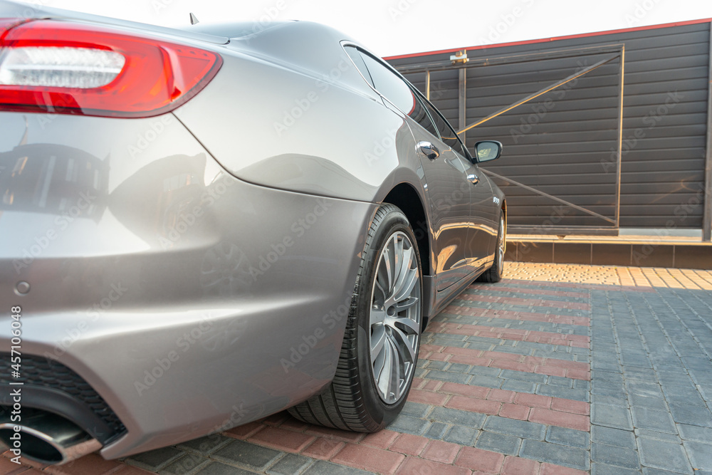 Front side view of the metallic color modern luxury car close up. The ...