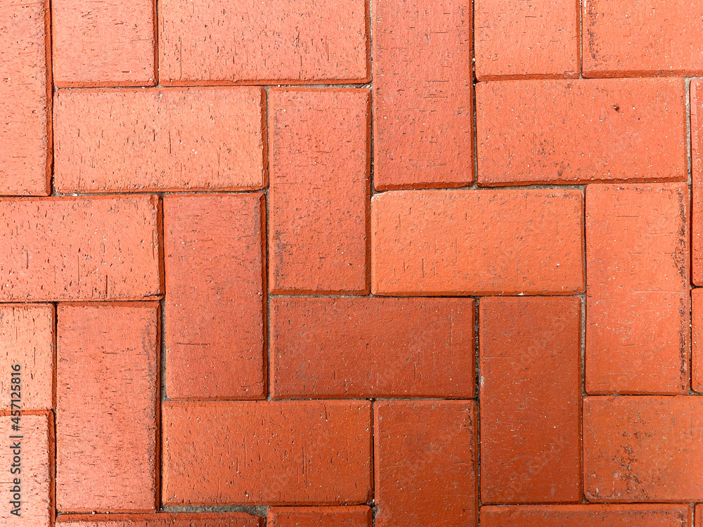 The texture of the paved tiles at the bottom of the street. Concrete ...