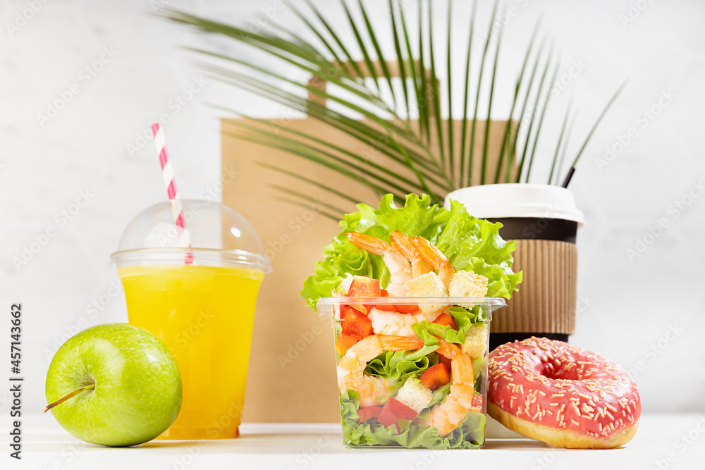 Healthy fitness food set of drinks, tropical shrimp salad in box, donut ...