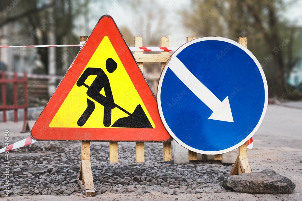 Warning sign of repair work, prescriptive sign indicating the side of ...