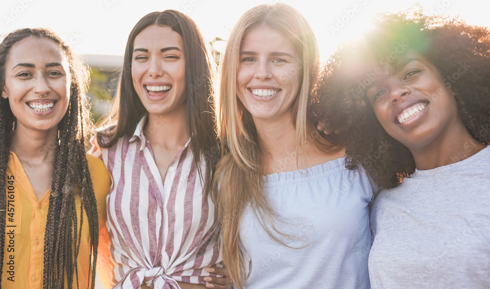 Beautiful multiracial girls looking and smiling on camera - Young women ...
