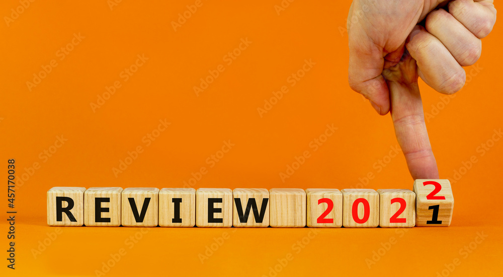 2022 review new year symbol. Businessman turns wooden cubes and changes ...