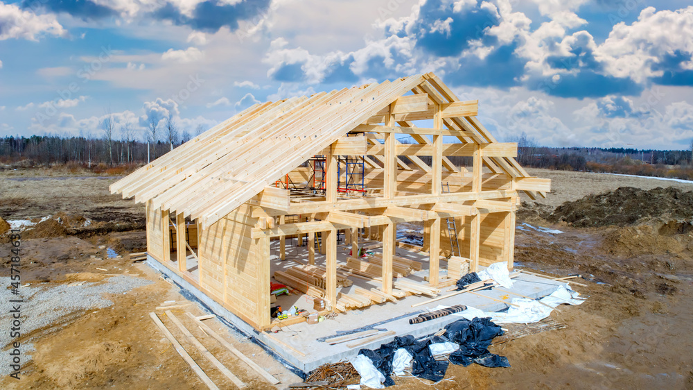 Timber frame houses top view. Frame of the house has a pitched roof ...