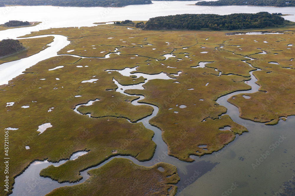 Narrow channels meander through a salt marsh in Pleasant Bay, Cape Cod ...