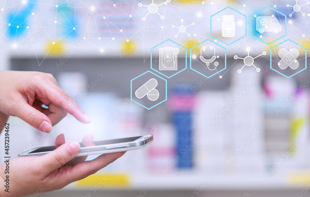 Pharmacist using mobile smart phone for search bar on display in ...