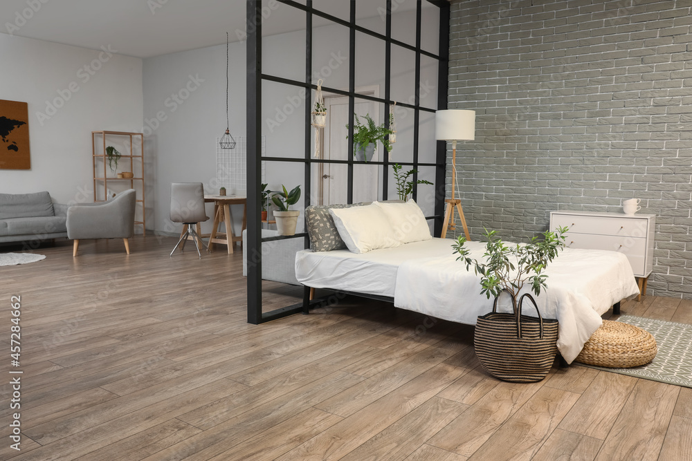 Interior of stylish bedroom with folding screen Stock Photo | Adobe Stock