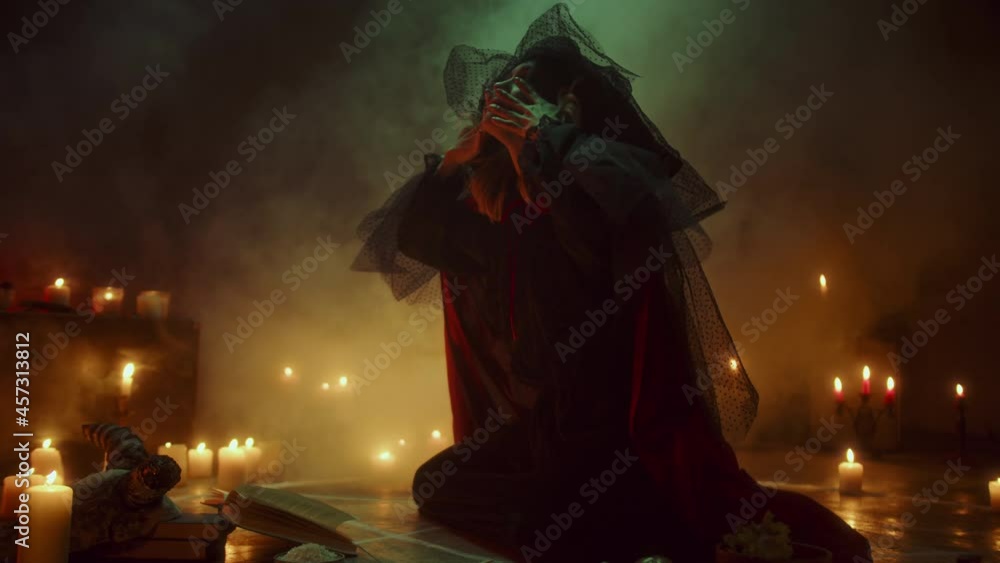 Witch woman sitting in pentagram circle and reading spell. Evil ...