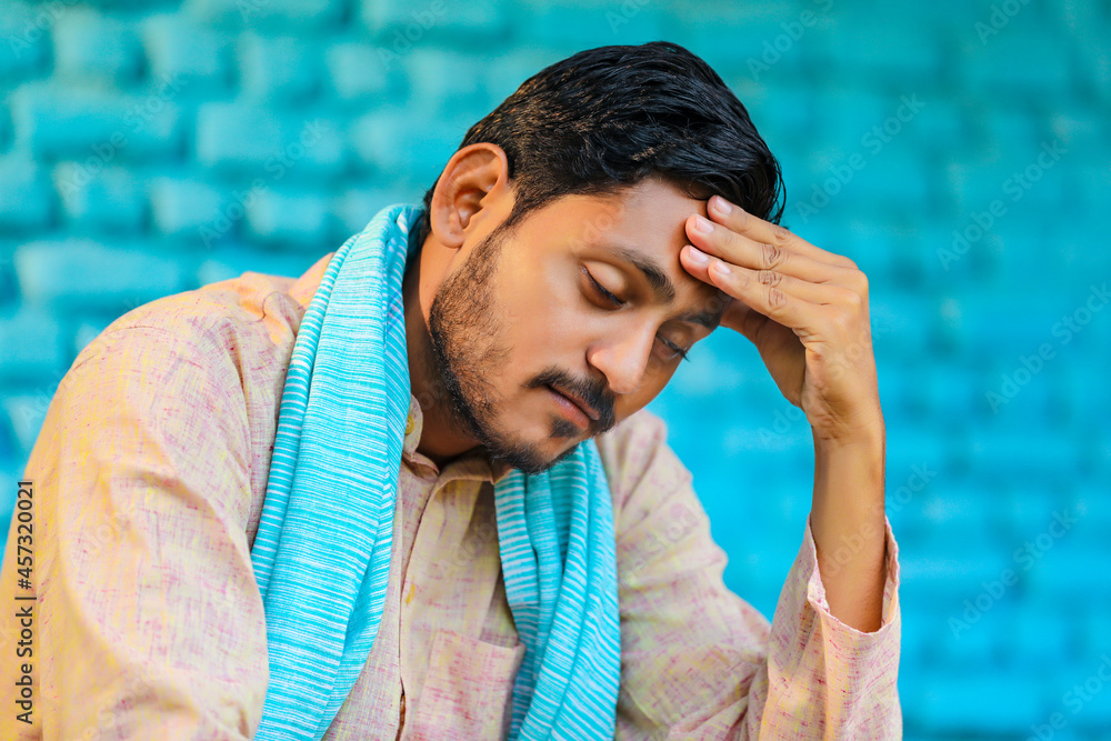 Young indian farmer in depression. Stock Photo | Adobe Stock