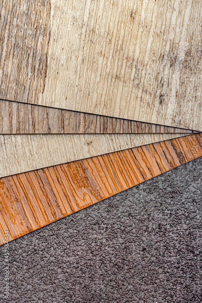 PVC vinyl sample. Vinyl floors. The swatches are brown with a woody ...