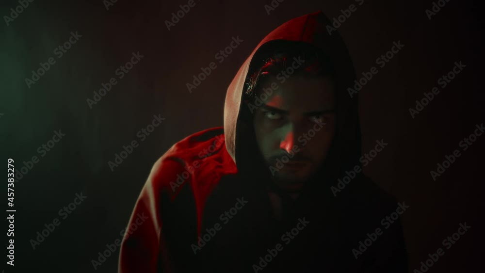 Man exorcist putting on cow skull mask close-up. Creepy devil costume ...