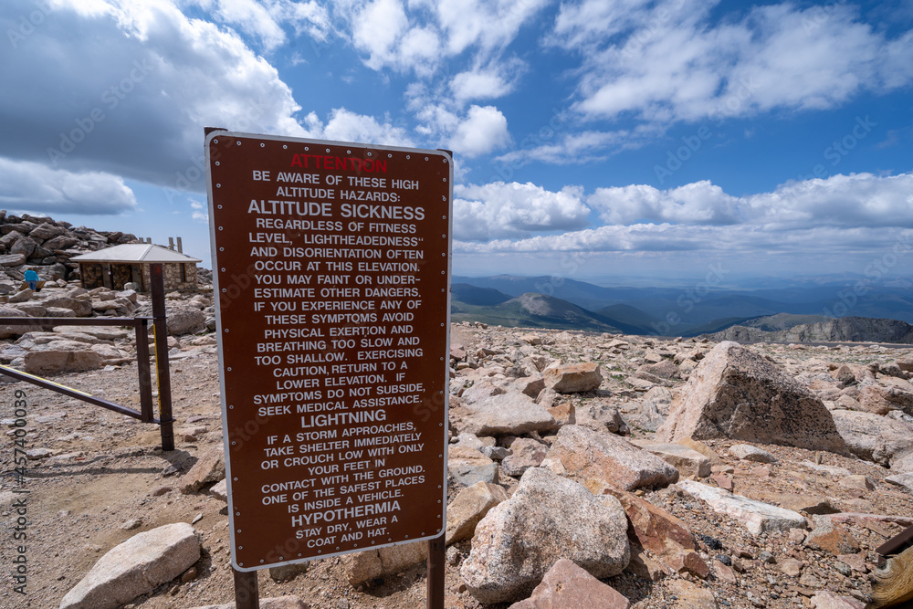 Poster Dire warning sign of lightning strikes and altitude sickness at ...
