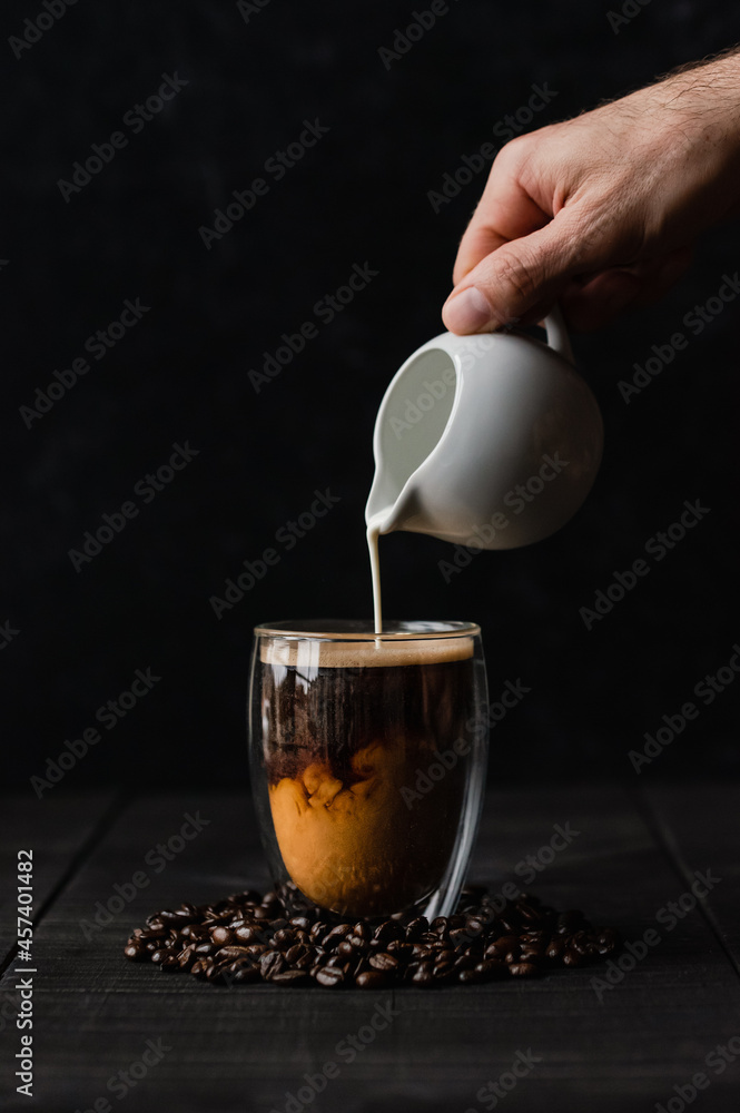 Pouring Cream Into Coffee