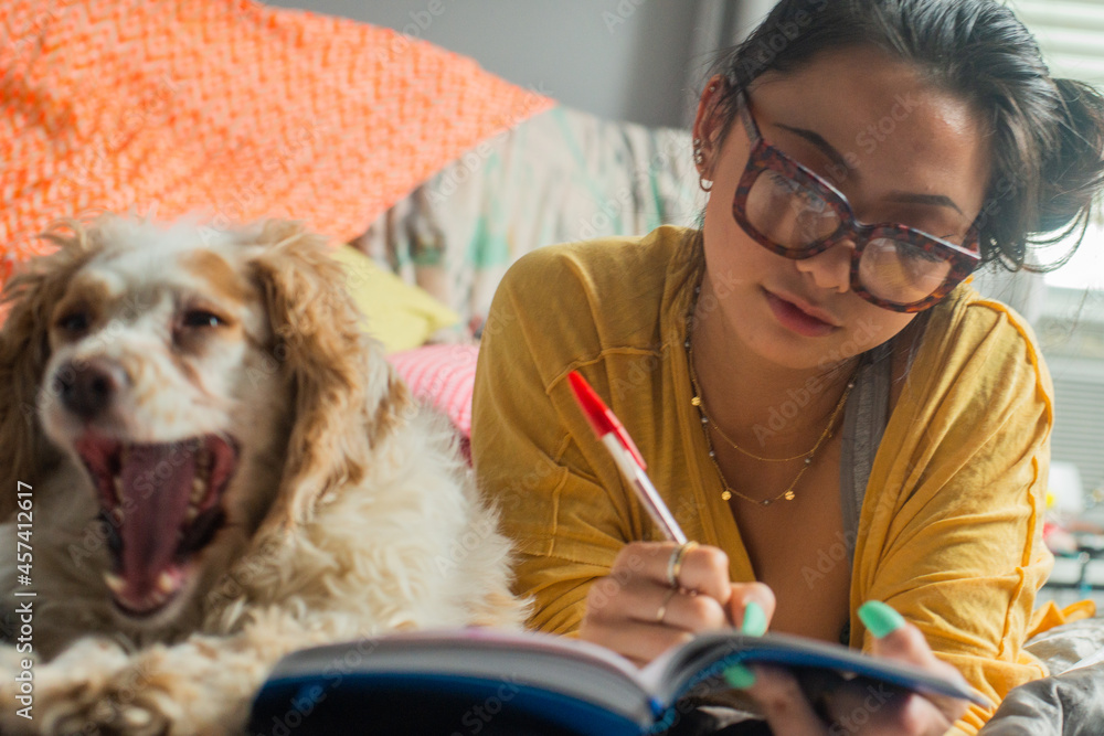 Gen Z writing in her journal Stock Photo | Adobe Stock