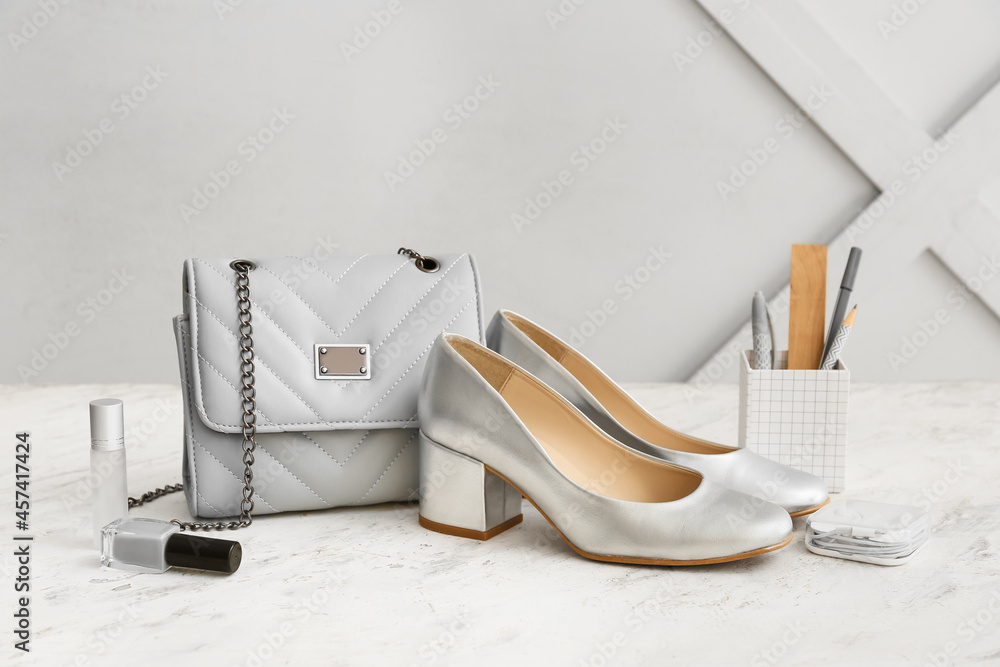 Stylish female accessories and shoes on light background Stock Photo ...