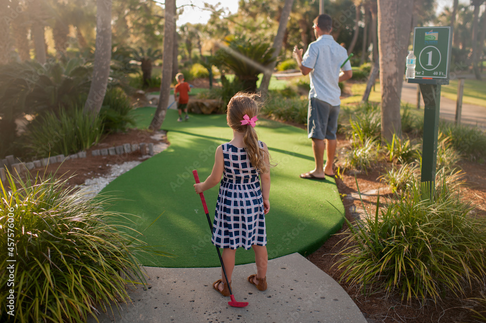 people playing putt putt mini golf Stock Photo | Adobe Stock