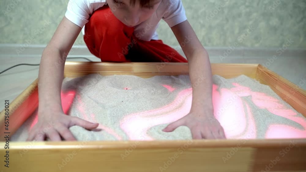 Video Stock The child draws on the light table with his hands. Drawings ...