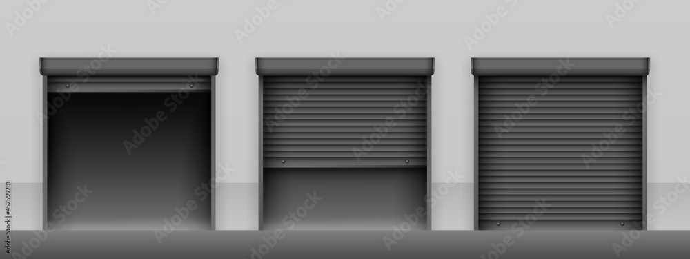 Set of black roller shutter gates on light grey wall of building. Open ...