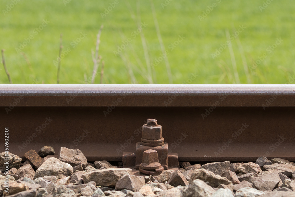 Steel railroad rail, railroad sleepers, rusty bolts and nuts in ...
