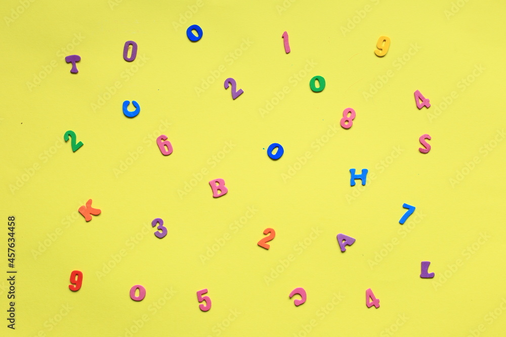 Words from multi colored letters on a yellow background. Expression ...