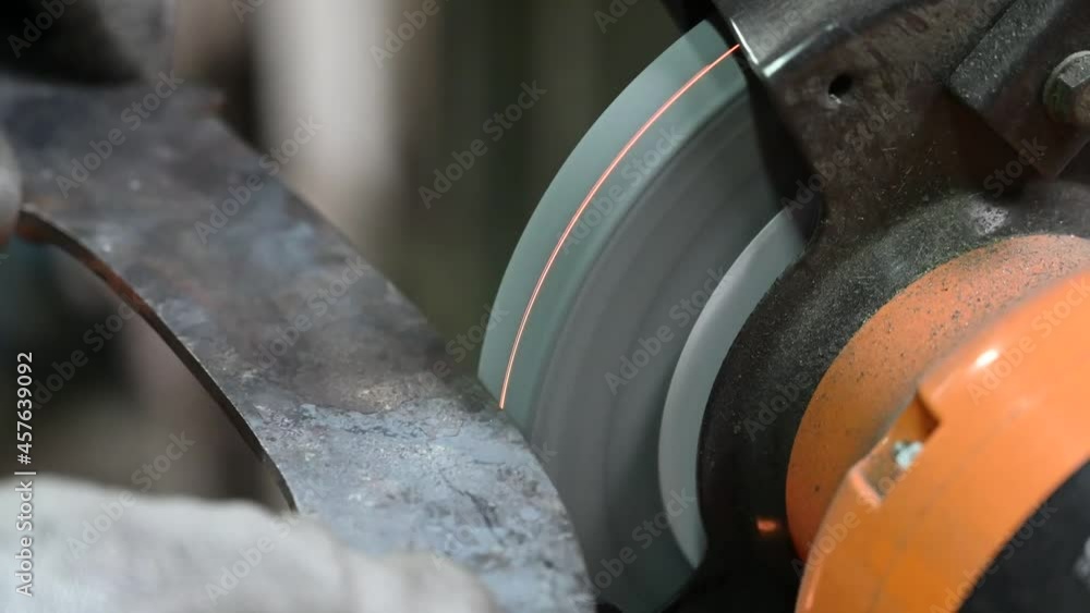 Man hands grinding a metal at work. Sparks from the grinder. Steel ...