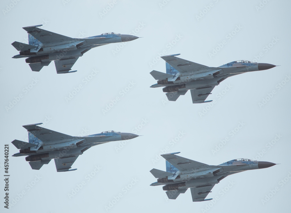 Three military fighter jets as part of a unit in the sky. Stock Photo ...