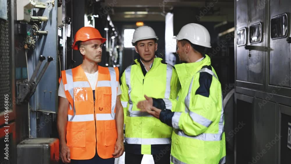Video Stock Group of three engineer team with perfect safety uniform ...