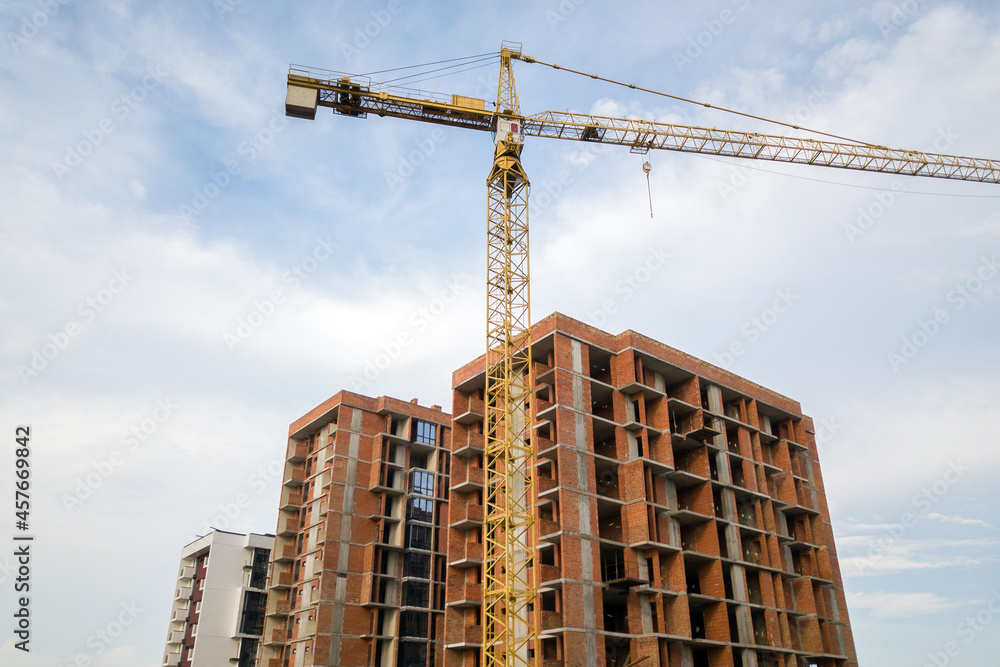 High-rise residential apartment buildings and tower crane under ...