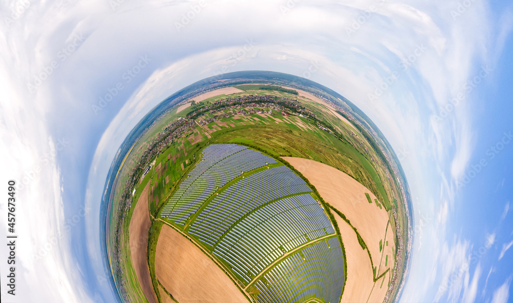 Little planet with big sustainable electric power plant with many rows ...