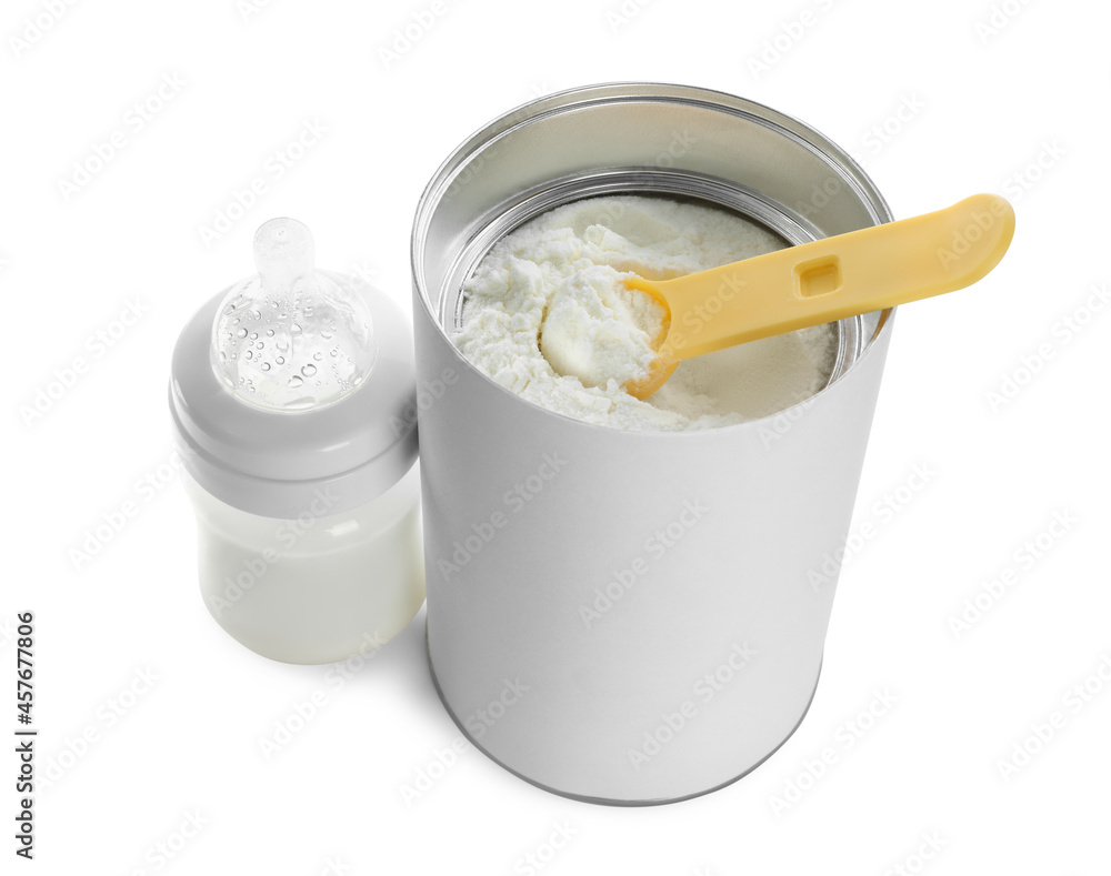Blank can of powdered infant formula with feeding bottle and scoop on ...