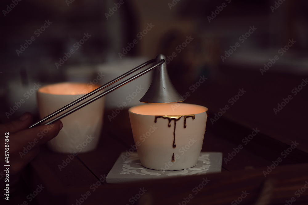 candle turned off putting off fire. Stainless steel put out candle ...