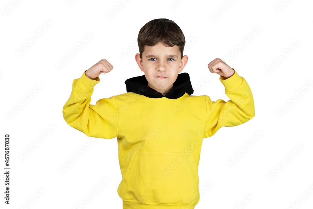 On a white background a young boy raised his hands and shows how strong ...