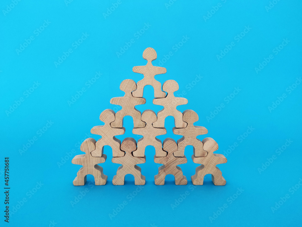 Teamwork and cooperation concept, wooden people standing shoulder to ...