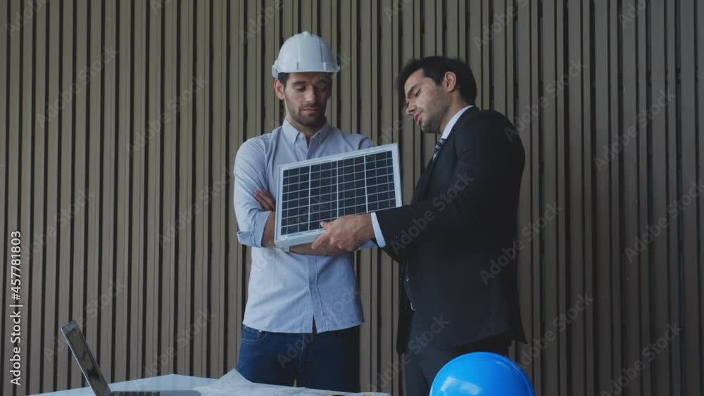 Team engineer talking and planning about install electric with panel of ...