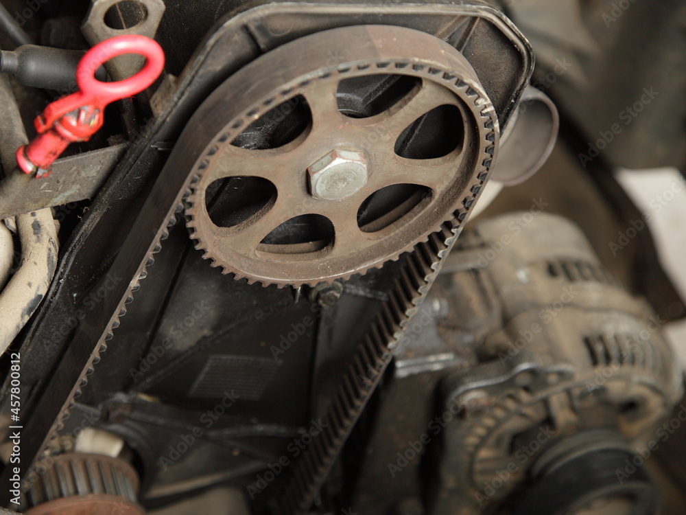 SOHC timing belt and camshaft drive gear cogwheel on car motor front ...