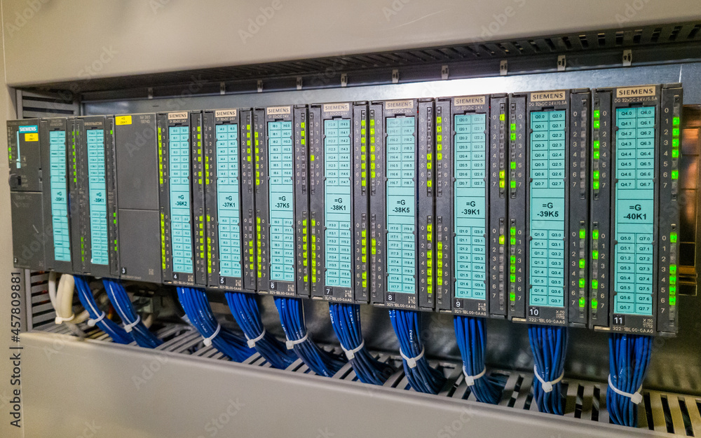 PLC modules in a row in electrical cabinet of automation control ...