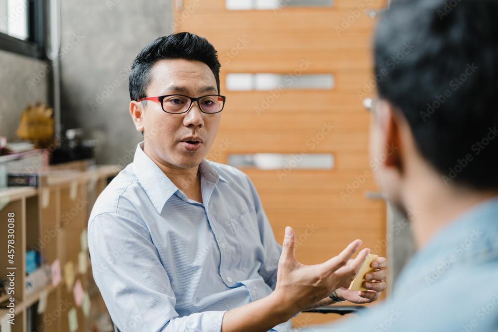 Asia businesspeople chatting to intern discussing job interview ...