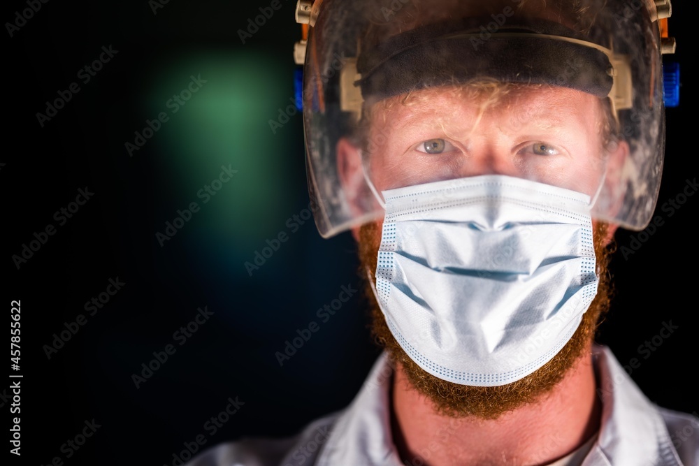 Covid doctor, nurse and health care worker, putting on a mask and face ...