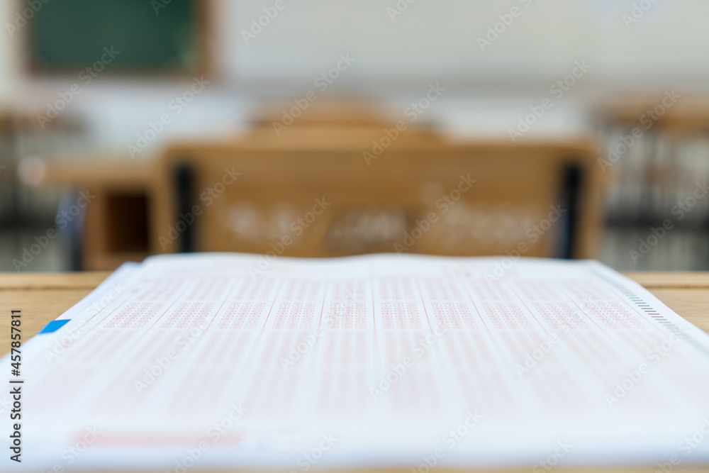 Document paper sheet exam on desk at school in Exam testroom, Blurred ...